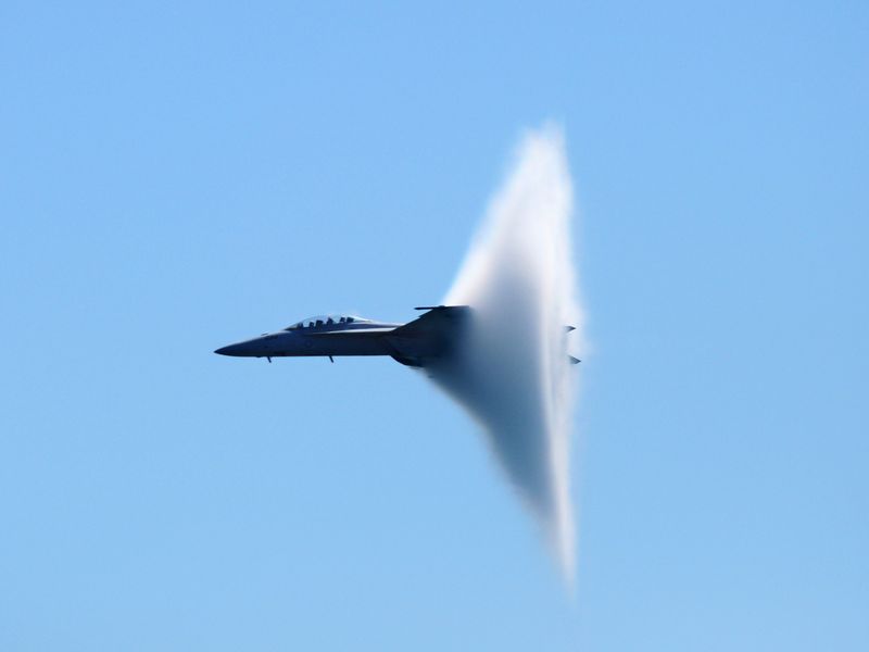 A Boeing F/A-18E/F Super Hornet breaking the sound barrier at the 2011 ...