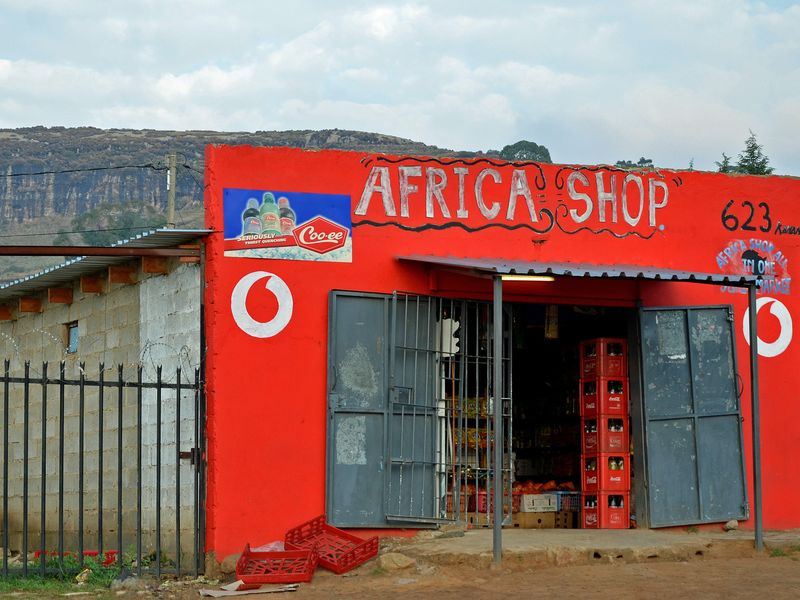 Driving past an African shop near Clarens in South Africa early in the ...