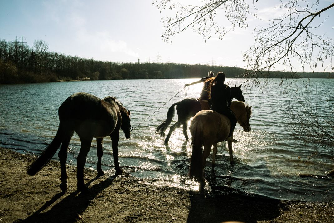 Horse riding by the lake. | Smithsonian Photo Contest | Smithsonian ...