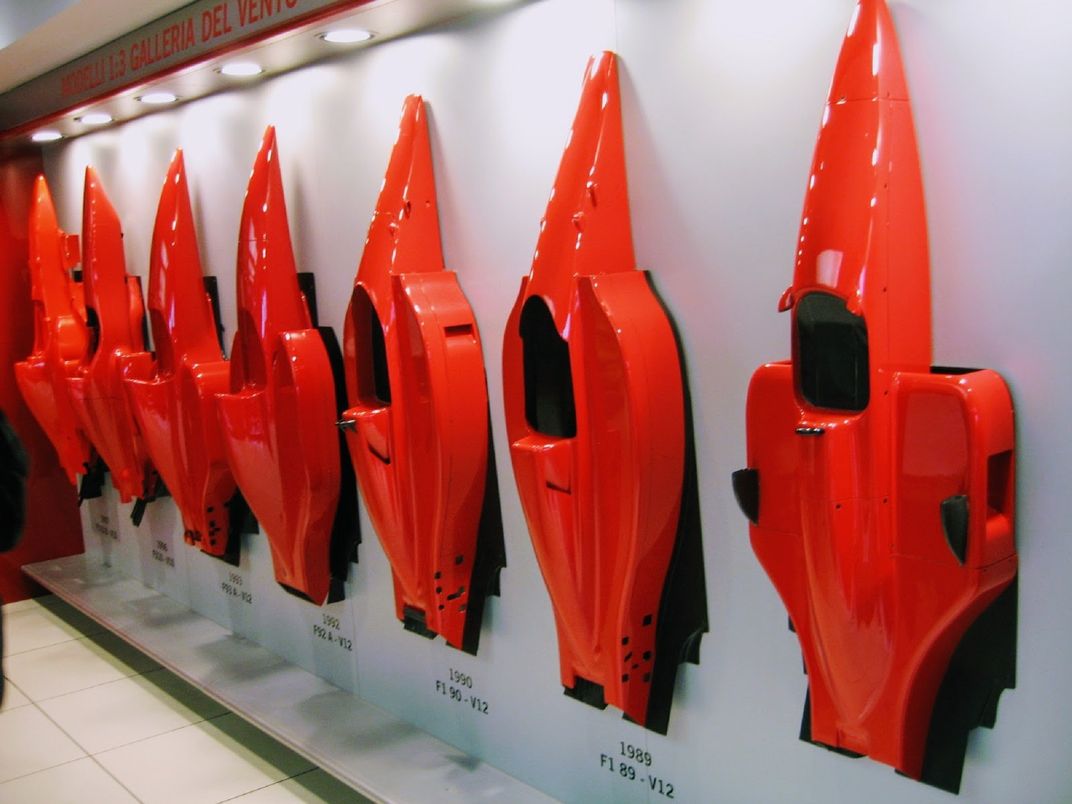 Red chassis hanging on wall at Museo Ferrari. | Smithsonian Photo ...