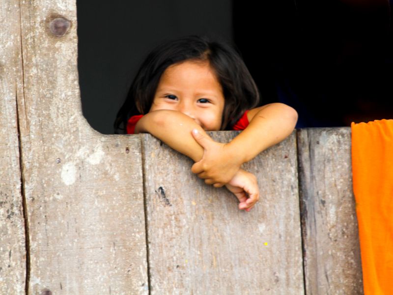 Watching the world - young girl in the slums of Iquitos Peru ...