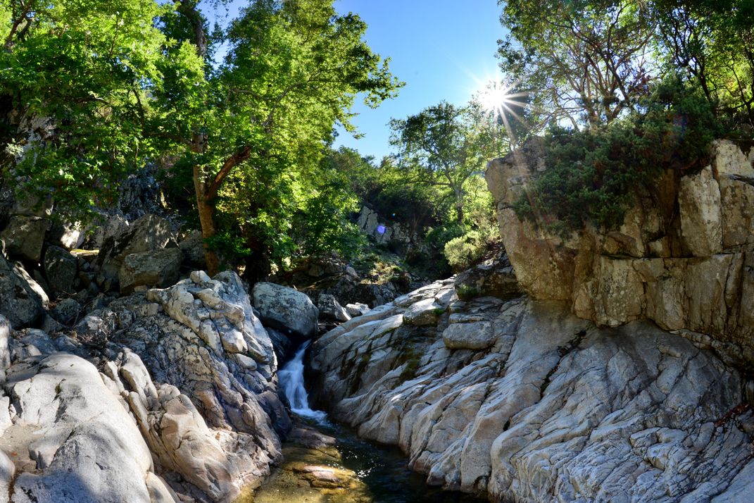Small waterfalls at the forest in Samothraki | Smithsonian Photo ...