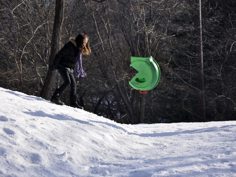 Good Bye Sled - A girl throws her broken sled off a mountain of snow in ...