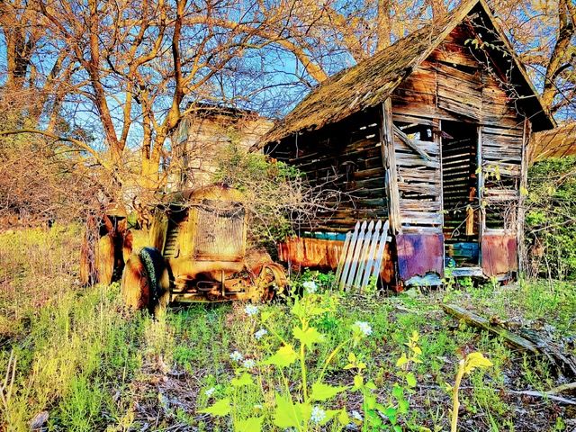 Remote Farm With a Tractor Parked Next To an Outhouse | Smithsonian ...