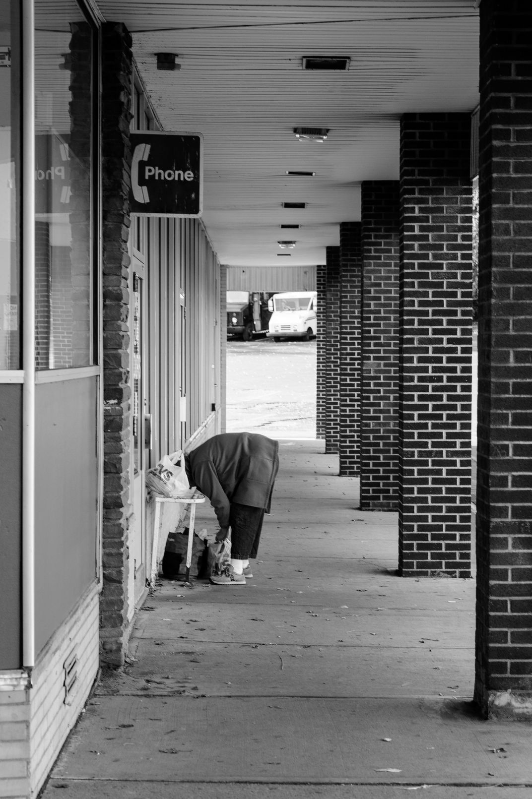 The Headless Woman- An elderly woman searches for something in one of ...