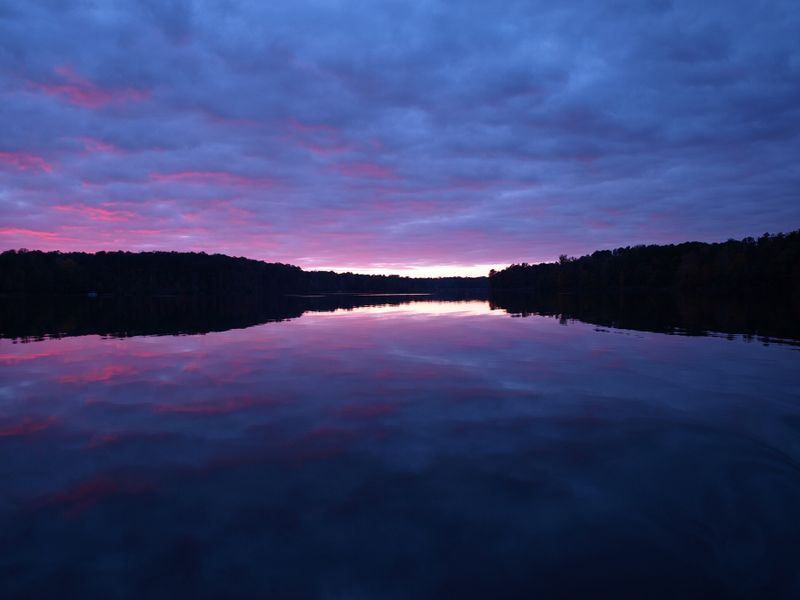 On a jon boat in the middle of Lake Varner at sunset. | Smithsonian ...