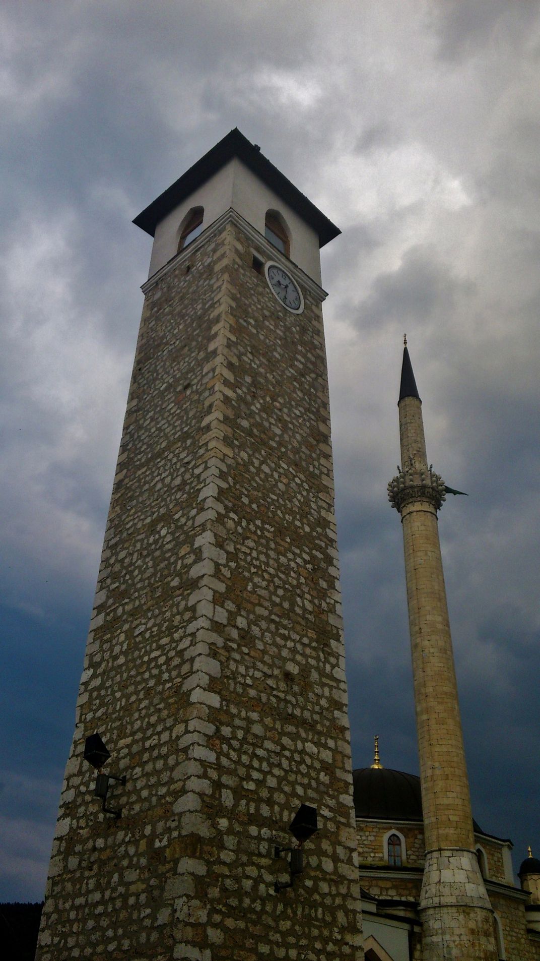 Clock Tower and Minaret of the 16th Century Hussein Pasha Mosque in ...