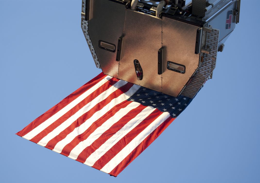 Flags hangs from a ladder truck at the 2nd Annual 9/11 Stair Climb ...