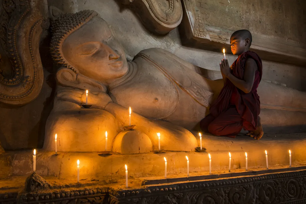 Buddhist Monk With Candles | Smithsonian Photo Contest | Smithsonian ...