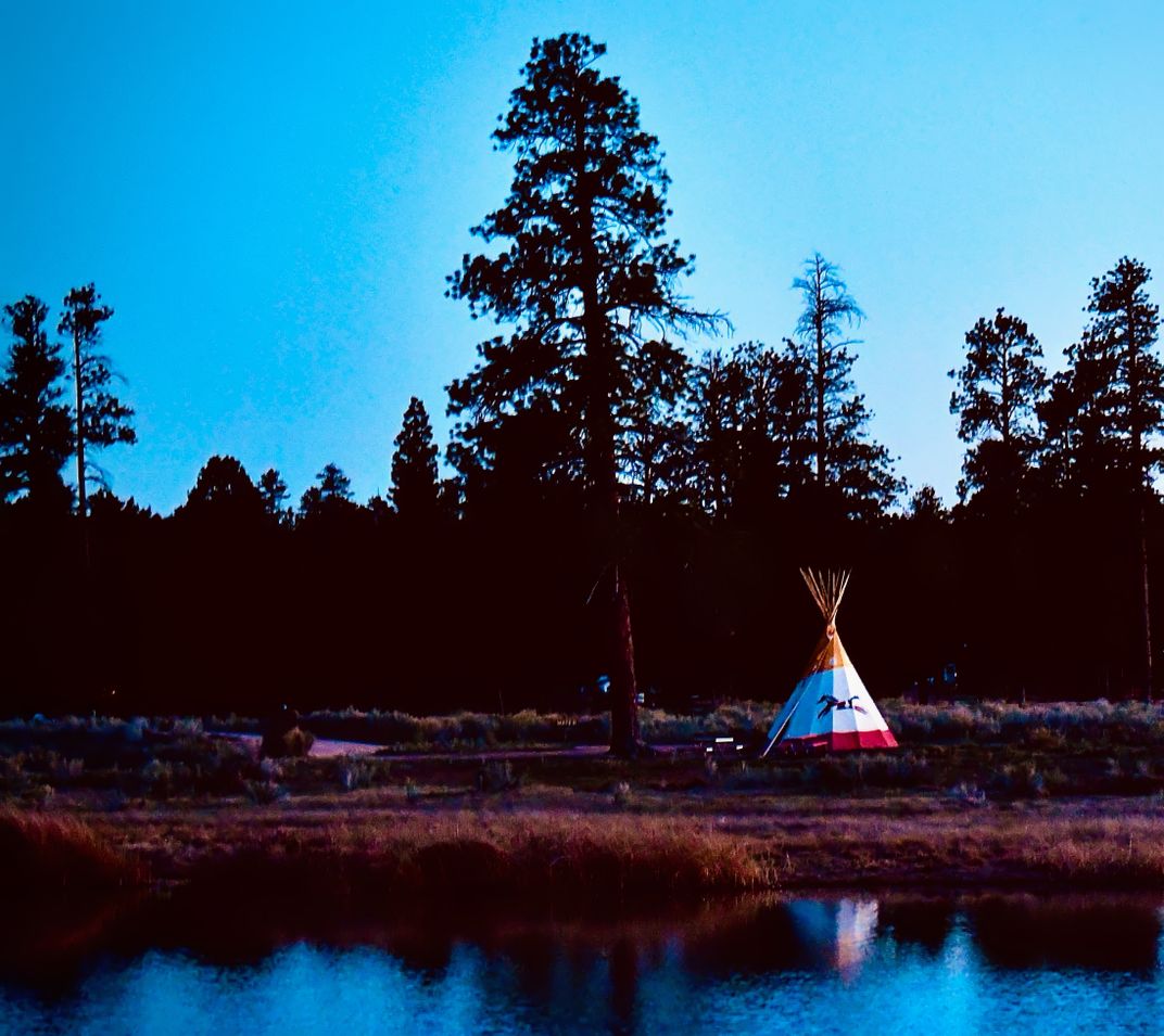 Nightfall and A Native American Teepee’s Reflection on The Lake ...