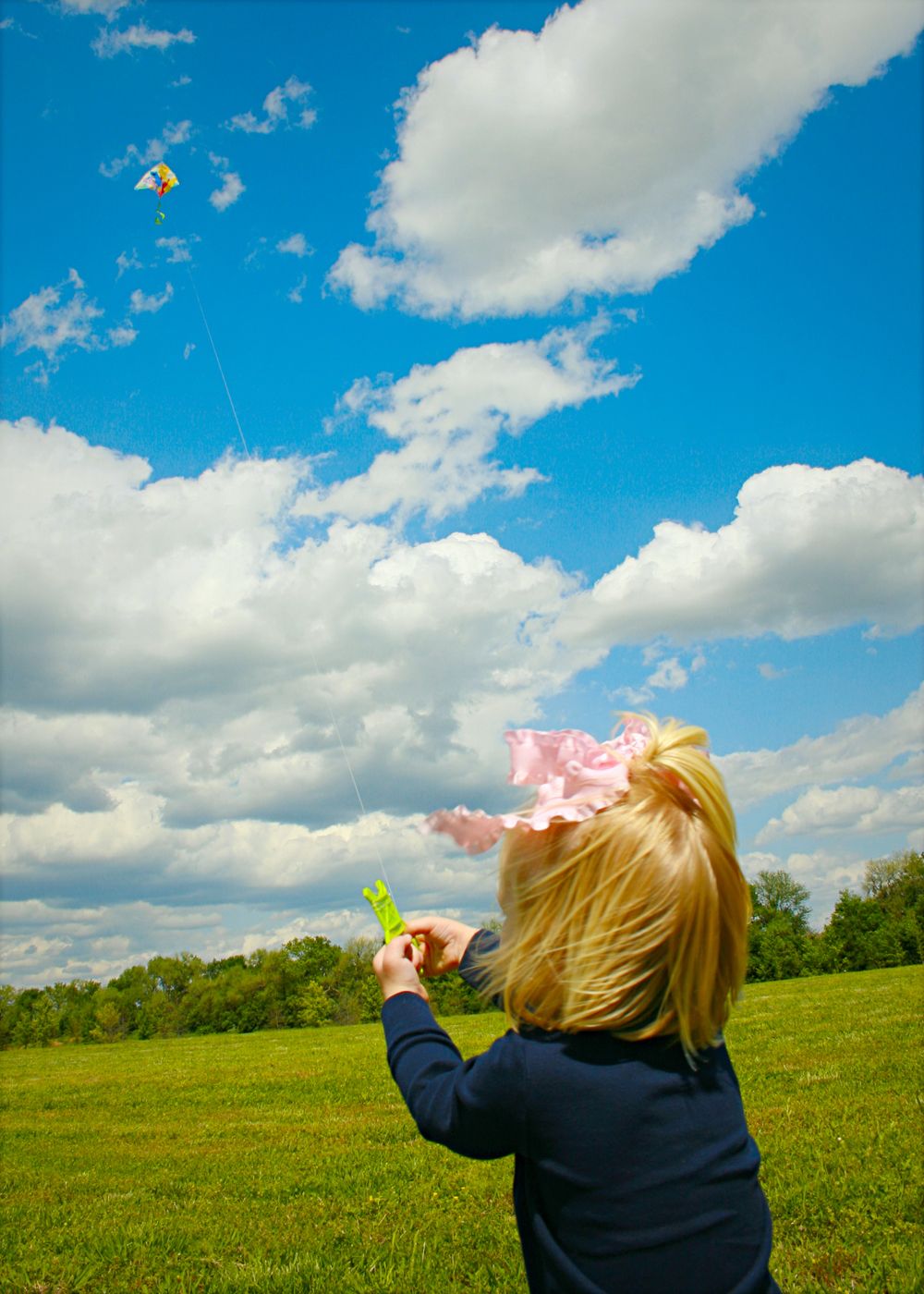 My daughter flying kite for the first time. Shows the determination of ...