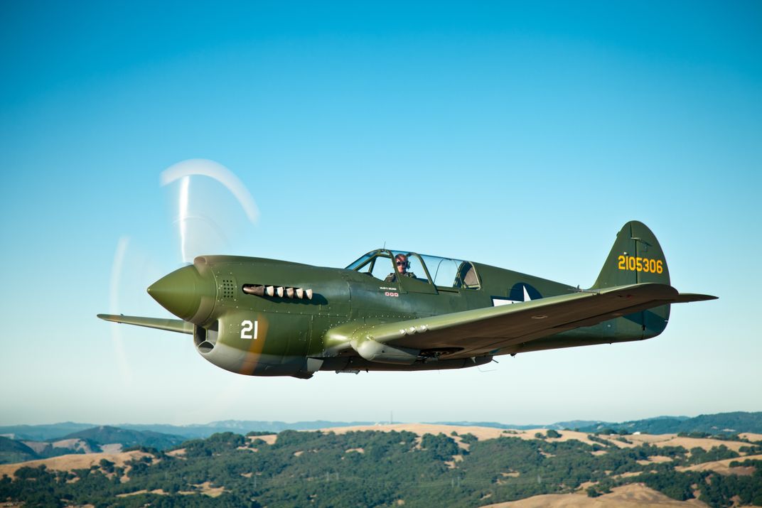 Pilot Chris Prevost flies his rare Curtis P-40 over the hills of Sonoma ...