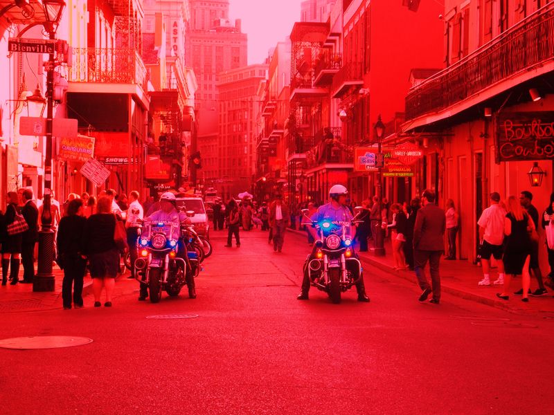 Crimson Bourbon Street with blue lights flashing | Smithsonian Photo ...