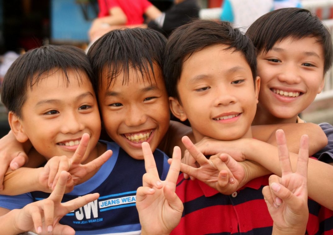 Four boys pose for a fun picture in DaNang, Vietnam. | Smithsonian ...