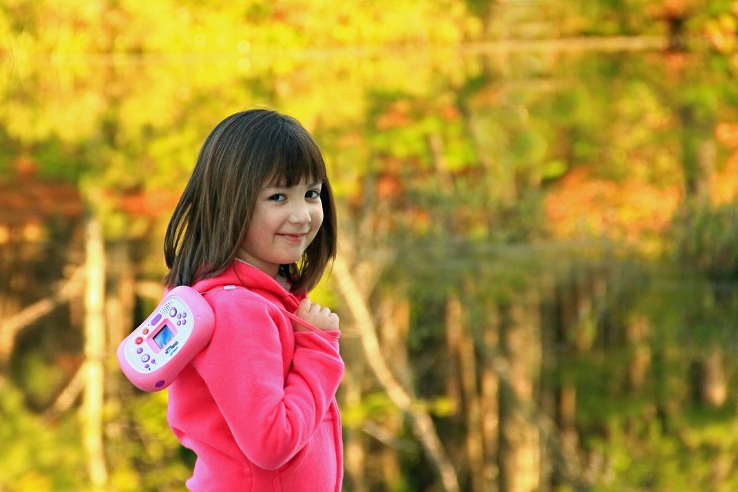 This is my youngest daughter (6 years old) posing with her camera by a ...