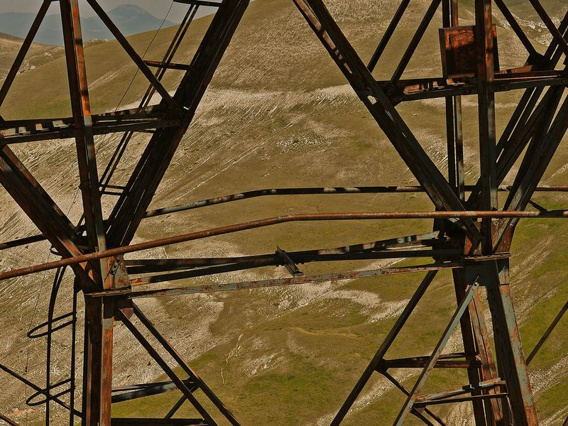 Triangles and mountains. Structure of a pylon of a disused cable car in ...