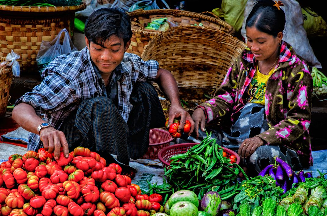 Working together in love, tenderness and pride. Young Burmese couple in ...