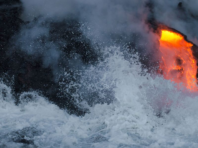 Lava flows from The Big Island of Hawaii as the Pacific Ocean fights ...