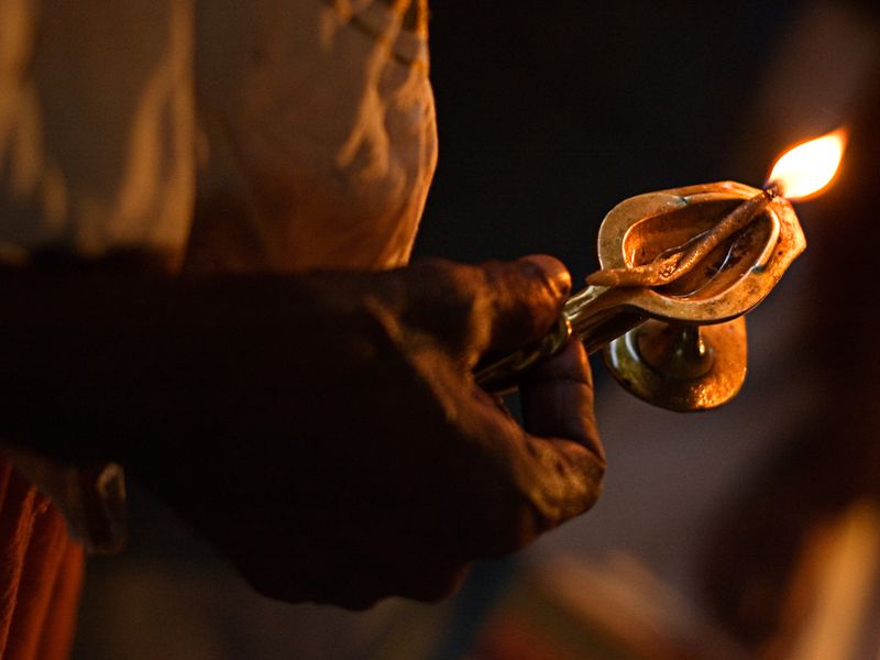 An old man holding an oil lamp. | Smithsonian Photo Contest ...
