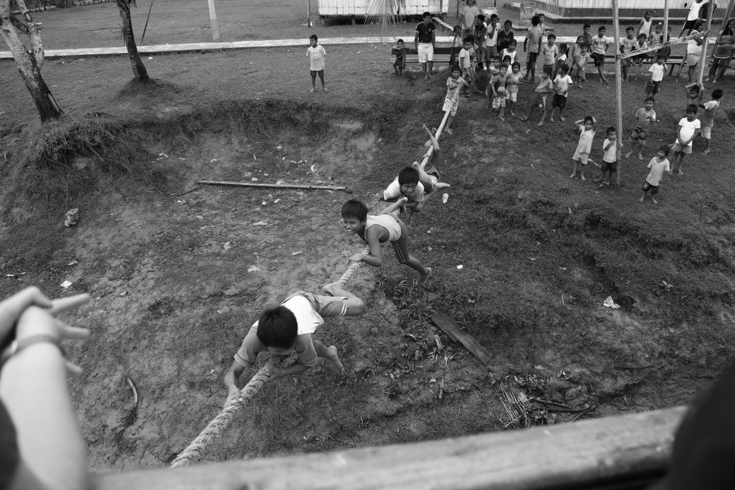Playing on the boat rope, Cocama Village, Peru | Smithsonian Photo ...