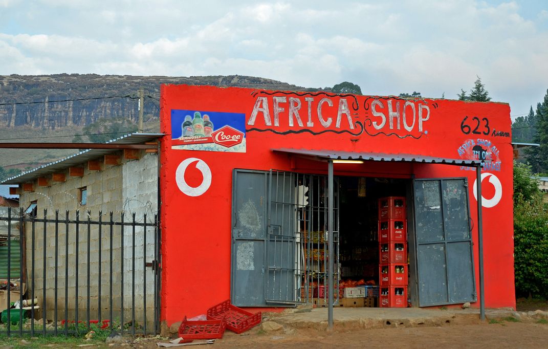 Driving past an African shop near Clarens in South Africa early in the ...