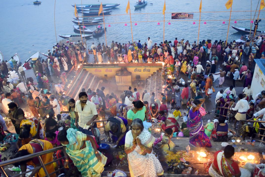 Crowd of devotees thronging the Kedar Ghat on Kartik Purnima morning ...