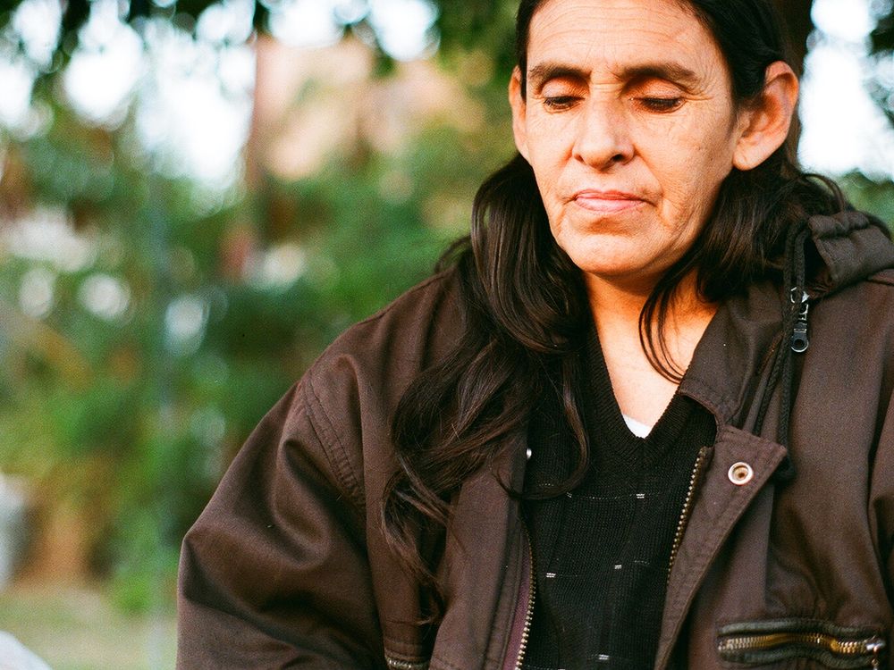 Gabriela on a winter afternoon outside the railroad, waiting for his ...
