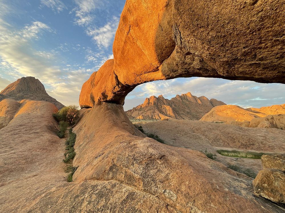 granite arche with rock formation in the back | Smithsonian Photo ...