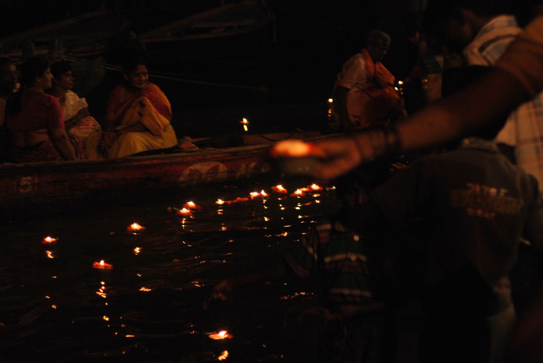 People floating their holy Pradip(Light) at Varanasi Ghat for the ...