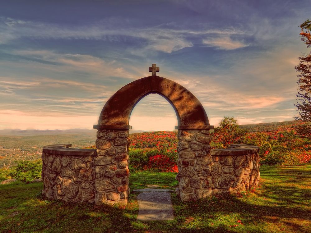 A magnificent view through a stone arch, from a mountain top in upstate ...