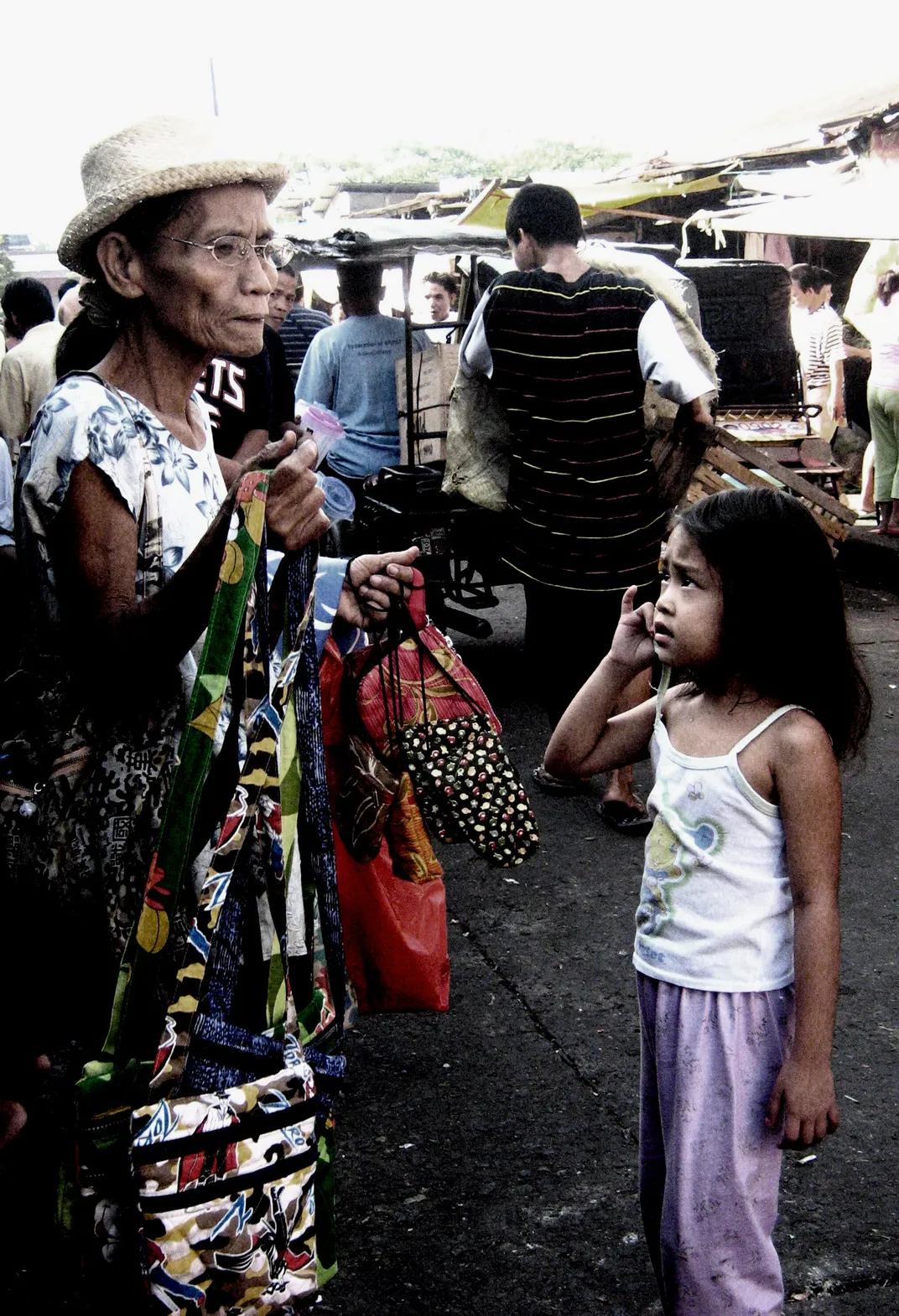 Little girl, and old woman selling purses | Smithsonian Photo Contest ...