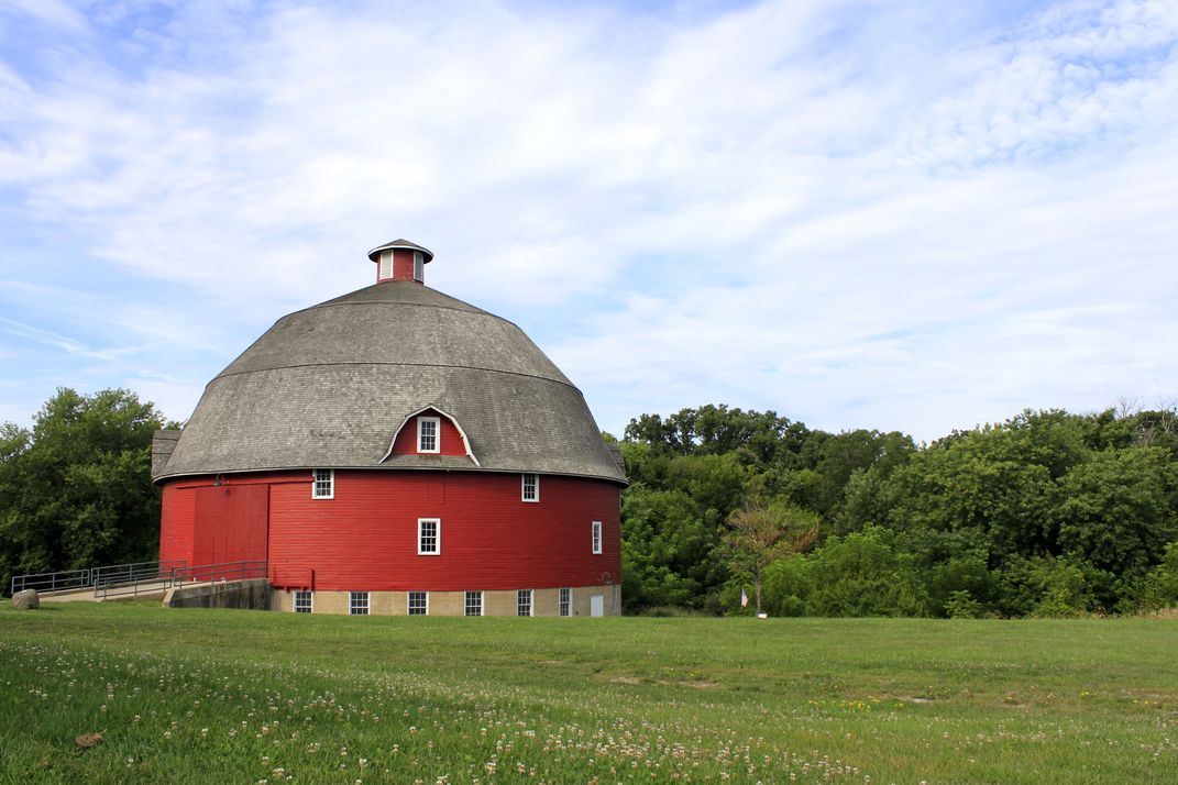 The bright red of Ryan's Round Barn was a sharp contrast with the blue ...