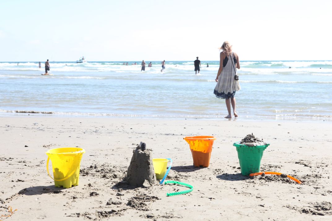 buckets on a beach, girl and sea in the background, Santa Monica ...