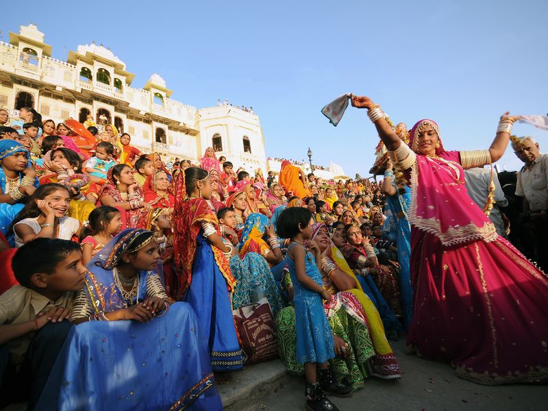 women from udaypur enjoying the sacred Gangaur festival by dancing and ...