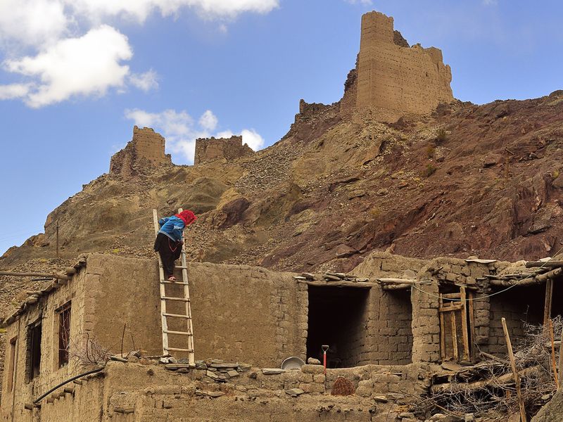 a girl climbs down the rampart of a fort that has been fashioned into a ...