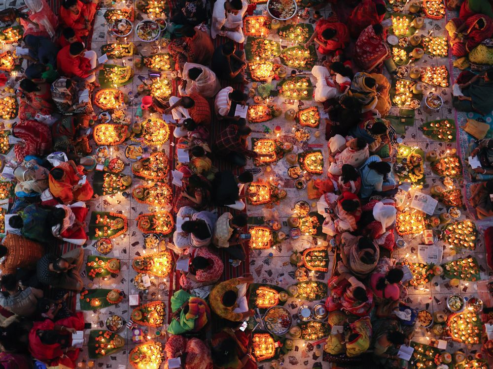 Hindu devotees praying with Lamps and foods in Fasting and Lighting of ...