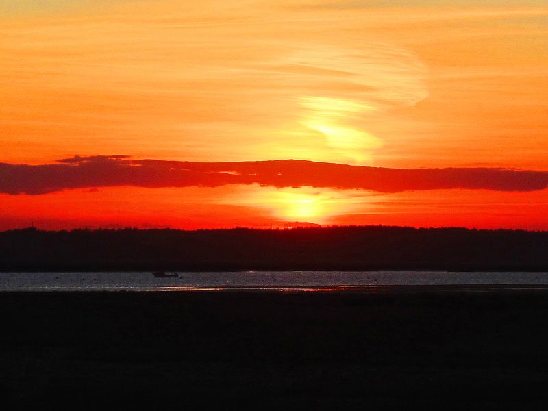Hampton Beach, NH, glows with the help of a multi-tiered sunset ...