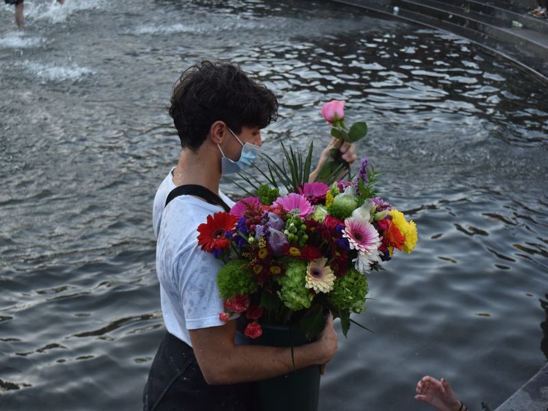 A kid handing out flowers | Smithsonian Photo Contest | Smithsonian ...