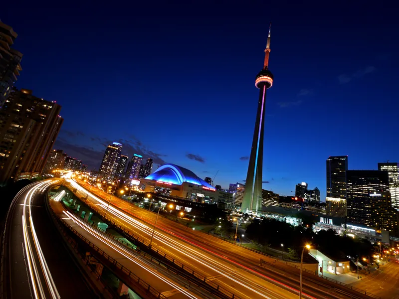 The CN Tower and sky dome, as seen just after dusk in downtown Toronto ...