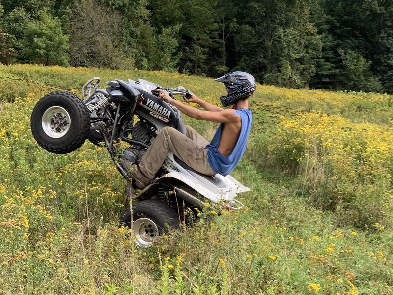 boy on four wheeler doing a wheelie | Smithsonian Photo Contest ...