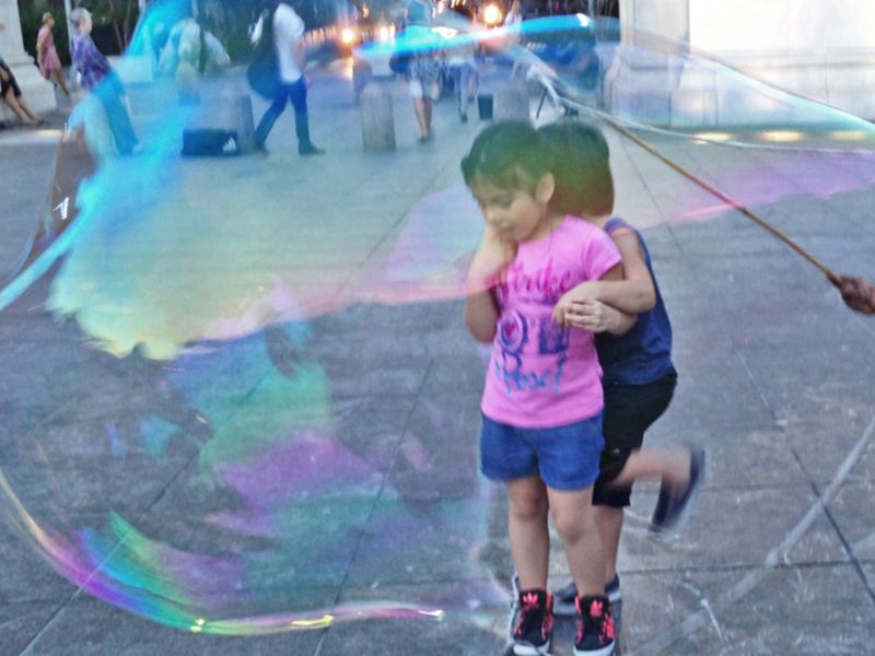 Two kids in a bubble. | Smithsonian Photo Contest | Smithsonian Magazine