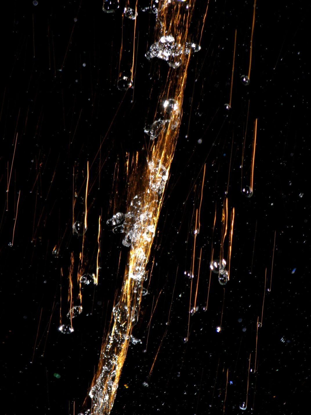 Rain glowing in the porchlight during a storm | Smithsonian Photo ...