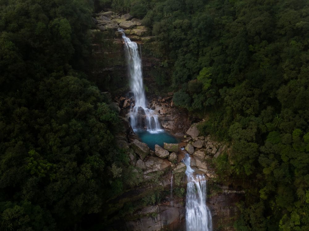 Majestic Umbyrlein Waterfall, nestled in the lush green landscapes of ...