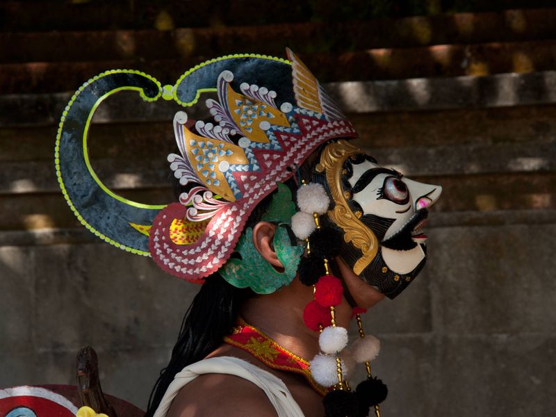 A Topeng dancer preparing himself behind the stage before the ...