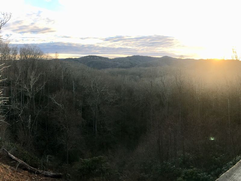 The first lights of sunrise illuminating the Appalachian Mountains ...