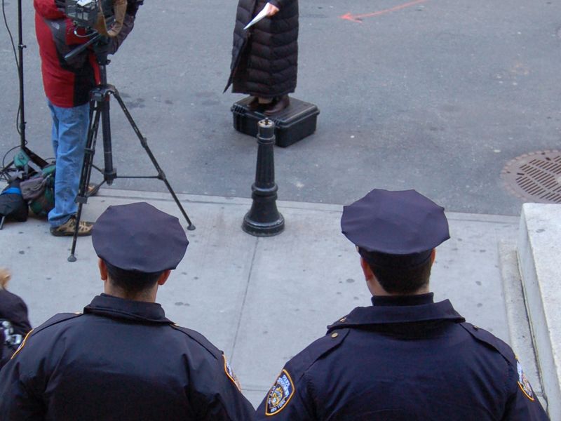 Ensuring freedom of the press: Police at NYC Federal Hall watch over a ...