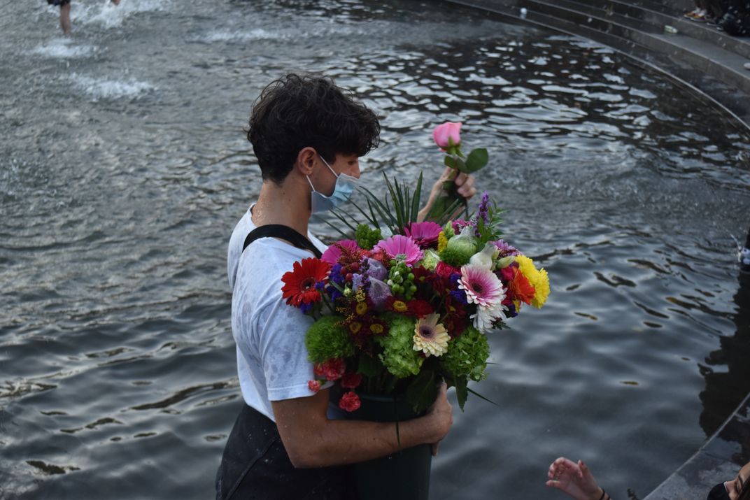 A kid handing out flowers | Smithsonian Photo Contest | Smithsonian ...