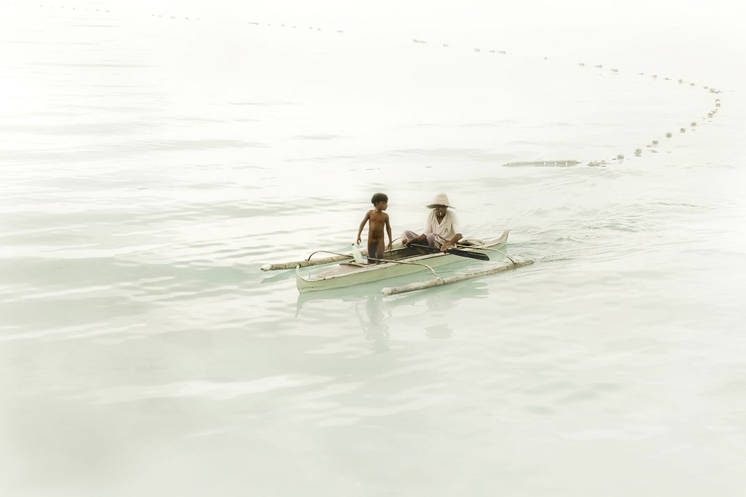 Young boy learning about the secrets of the ocean | Smithsonian Photo ...