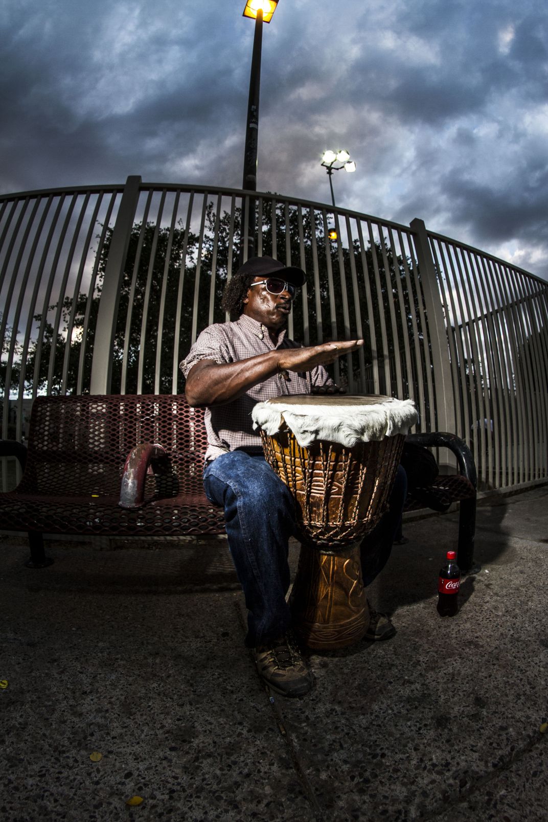 Bongo Player at Tempe Park using one strobe in my hand to light him up ...