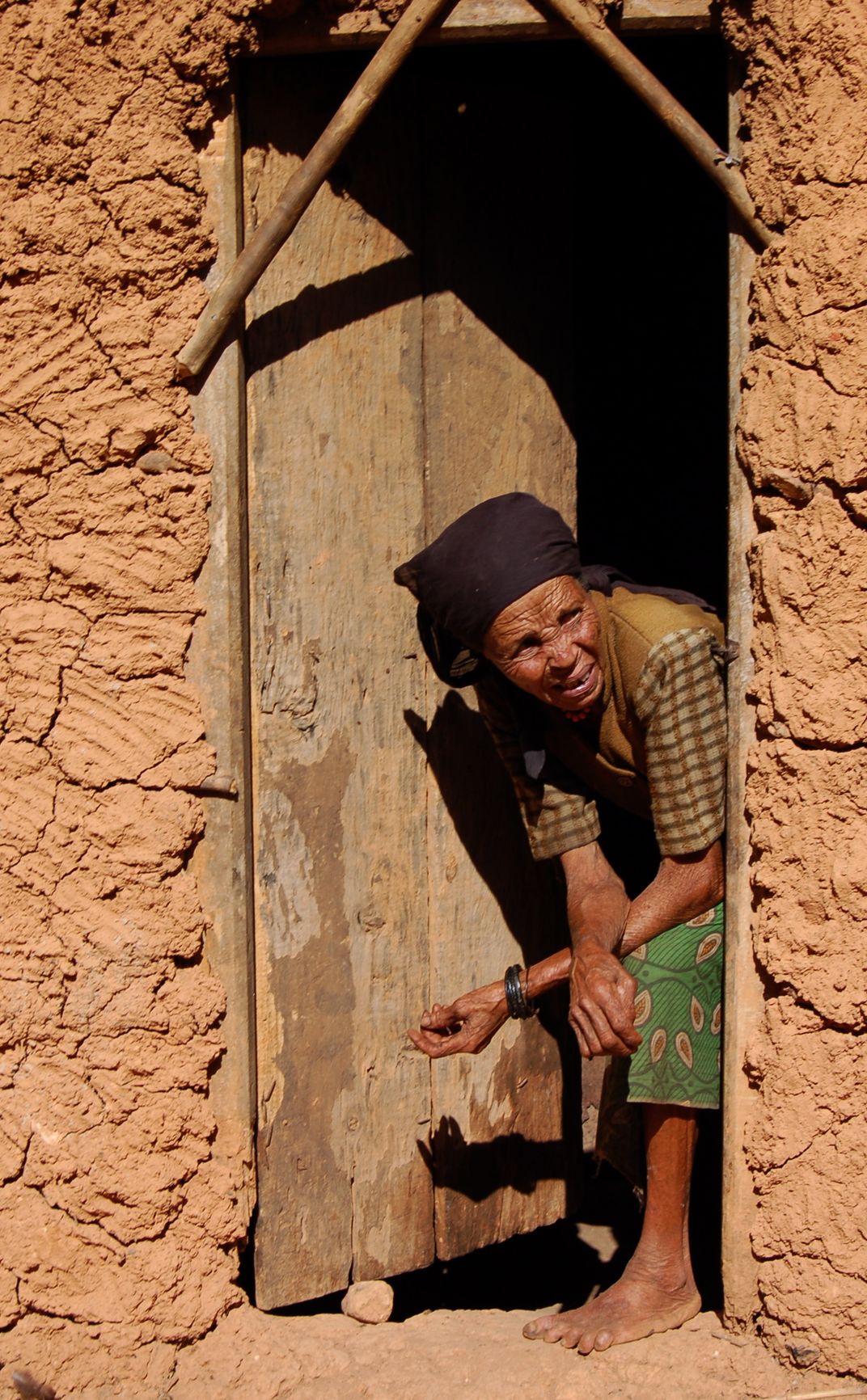 Old woman and shadow in doorway. | Smithsonian Photo Contest ...